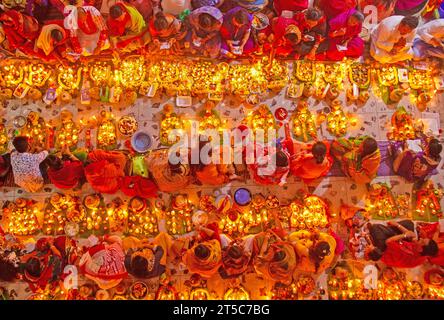 Dhaka, Bangladesh. 4th Nov, 2023. Hindu devotees sit with Prodip ...