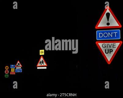 Tom Biddulph's installation. a set of revised road signs giving ...