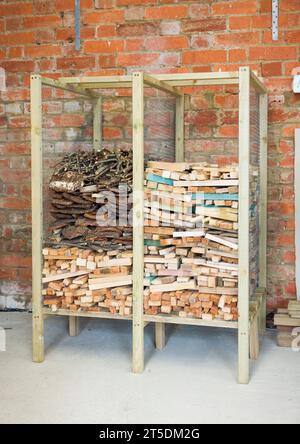 Wooden rack for storing kindling, kindling storage inside a garage, UK ...