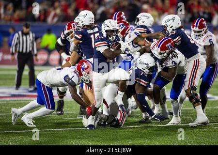 Liberty running back Quinton Cooley (20) runs with the ball and is ...