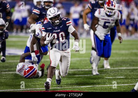 Liberty running back Quinton Cooley (20) runs with the ball and is ...