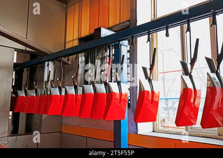 Steel spade spray paint production line Stock Photo - Alamy