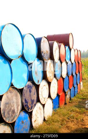 oil drums stacked together in a yard, north china Stock Photo - Alamy