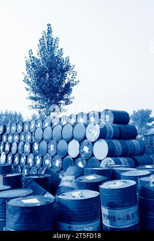 oil drums stacked together in a yard, north china Stock Photo - Alamy
