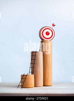Target and achievement concept. Wooden ladders and one leading to ...