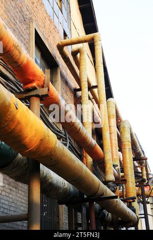 material pipe wrapped in thermal insulation in a factory Stock Photo ...