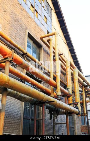 material pipe wrapped in thermal insulation in a factory Stock Photo ...