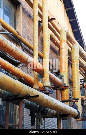 material pipe wrapped in thermal insulation in a factory Stock Photo ...