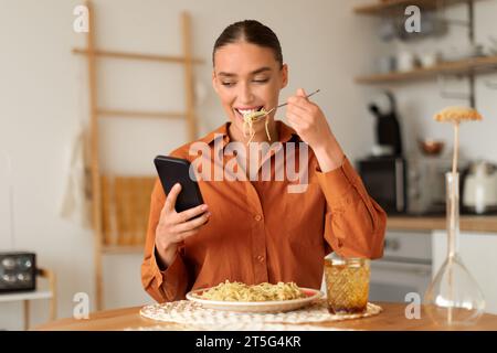 Checking smartphone, woman in button-down viewing terminal overlay at ...