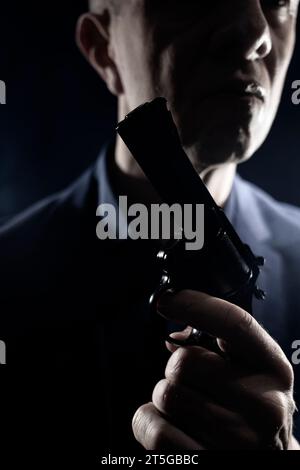 Assasin spy killer with handgun pistol in elegant suit and shirt book ...
