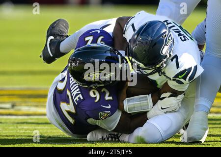 Baltimore Ravens defensive tackle Justin Madubuike (92) takes down ...