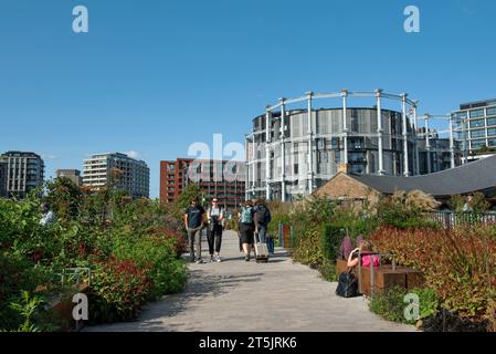 People walking along Bagley Walk, Kings Cross, London Borough of Camden ...