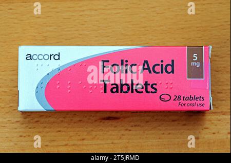 Packet of Folic Acid tablets on wooden background. 5mg tablets Stock ...