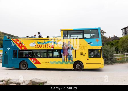 Portland coaster open top tour bus of the Jurassic coast picking up ...