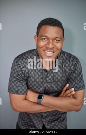 Portrait of an attractive cool guy on a gray background Stock Photo - Alamy