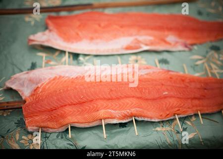 Salmon being cleaned and cooked for the annual First Salmon Feast ...