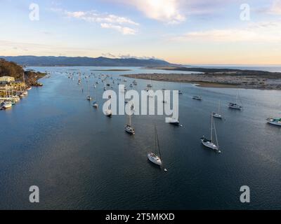 An aerial landscape view of aligned boats on the coast in Liguria ...