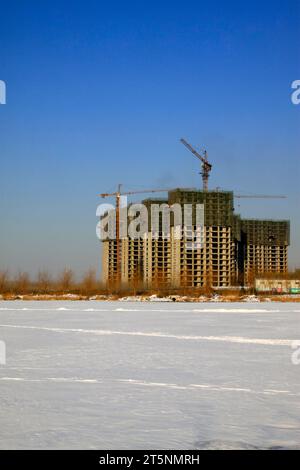 Unfinished buildings in the snow, in northern China Stock Photo - Alamy