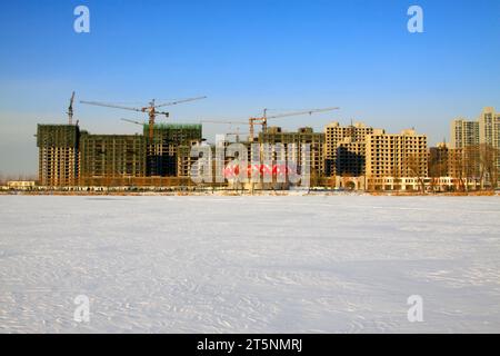 Unfinished buildings in the snow, in northern China Stock Photo - Alamy