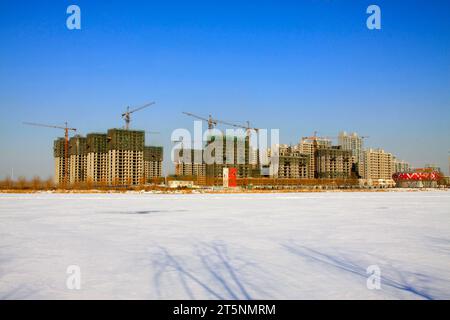 Unfinished buildings in the snow, in northern China Stock Photo - Alamy