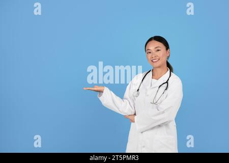 Young Asian female physician presenting anatomy model during online ...