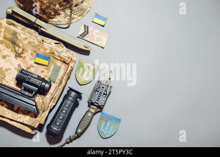 Ukrainian military gear flat lay background. Army tactical uniform ...