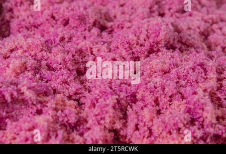 Pile of pink kinetic sand on white background Stock Photo - Alamy