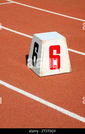 Wooden track number mark on the plastic runway, closeup of photo Stock ...