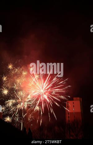 Fireworks over buildings Stock Photo - Alamy