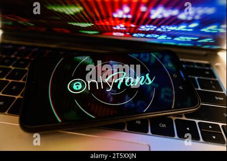 In this photo illustration, a OnlyFans logo seen displayed on a ...