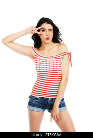 Wink, kiss and peace sign with portrait of woman in studio for support ...