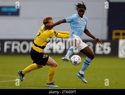 BSC Young Boys' Ryan Wyss (left) and Manchester City's Mahamadou Susoho ...