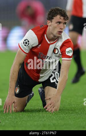 Feyenoord's Dutch midfielder Mats Wieffer challenges for the ball with ...