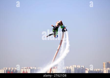Water stunts performance in a park Stock Photo - Alamy