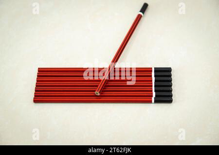 Traditional wooden pencils with red and black colored Stock Photo - Alamy