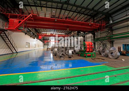 Strip steel and machinery in the workshop Stock Photo - Alamy