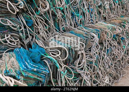 Marine fishing nets stacked together Stock Photo - Alamy