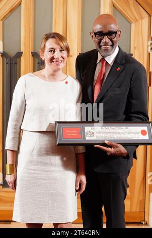 Helen Veale (left) with husband Sir Trevor Phillips as he is granted ...