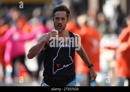 Runner Robert Gomez of Biddeford, Maine gets some needed relief with ...