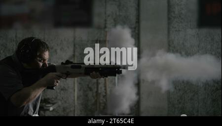 Person Shooting Powerful Shotgun, Ultra Slow-Motion Recoil and Fire at ...