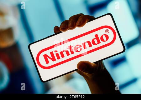 In this photo illustration, the Nintendo logo is displayed on a ...