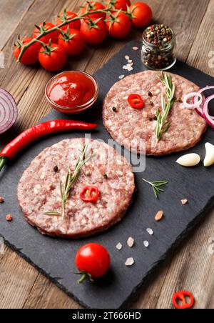 Raw beef burger cutlet for grill burger Stock Photo - Alamy