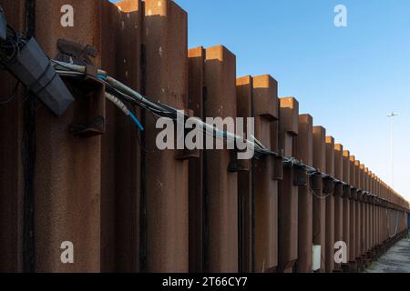 Security wall shows aging and dilapidation; electric and video ...