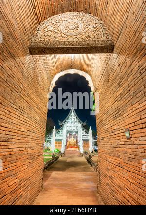 Tall, narrow, arched, short tunnel,lined with red brickwork,leading ...
