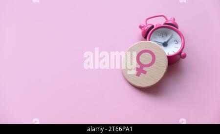 Menopause concept. Women symbol over a watch. Healthcare and medical ...