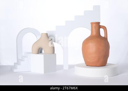 Clay flagon and decorative elements on white background Stock Photo - Alamy