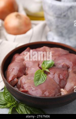 Pieces of unprepared chicken on table Stock Photo - Alamy