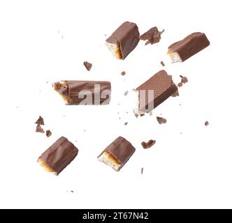 Pieces of chocolate bars with caramel falling on white background Stock ...