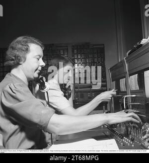 Telephone operator working at switchboard Stock Photo - Alamy