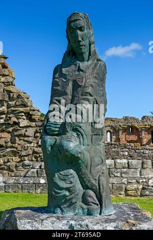 Statue of St Cuthbert, by Fenwick Lawson. At Lindisfarne Priory, Holy ...